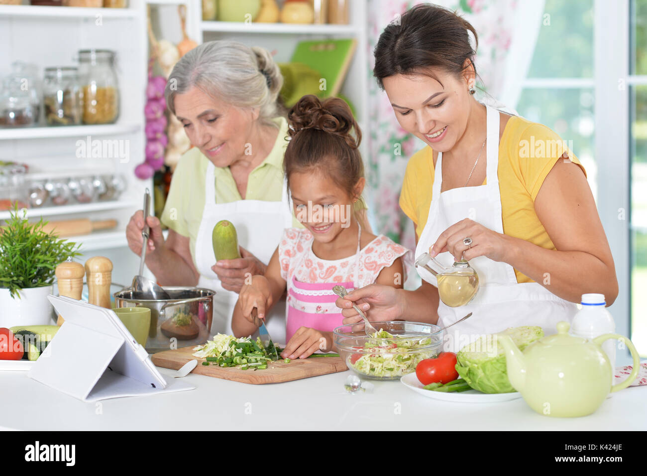 family preparing dinner Stock Photo - Alamy