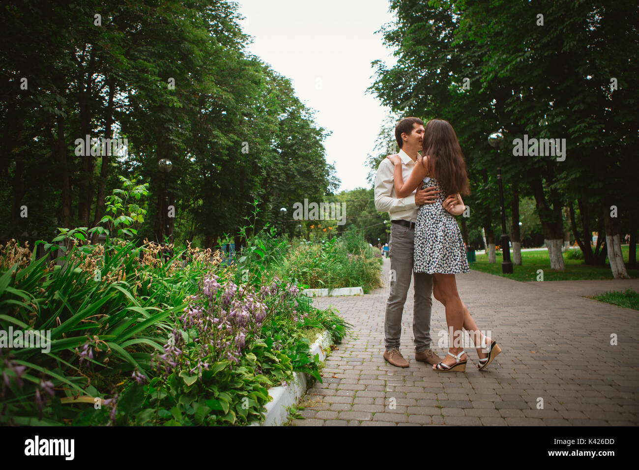 Beautiful young couple on a nature background Stock Photo - Alamy