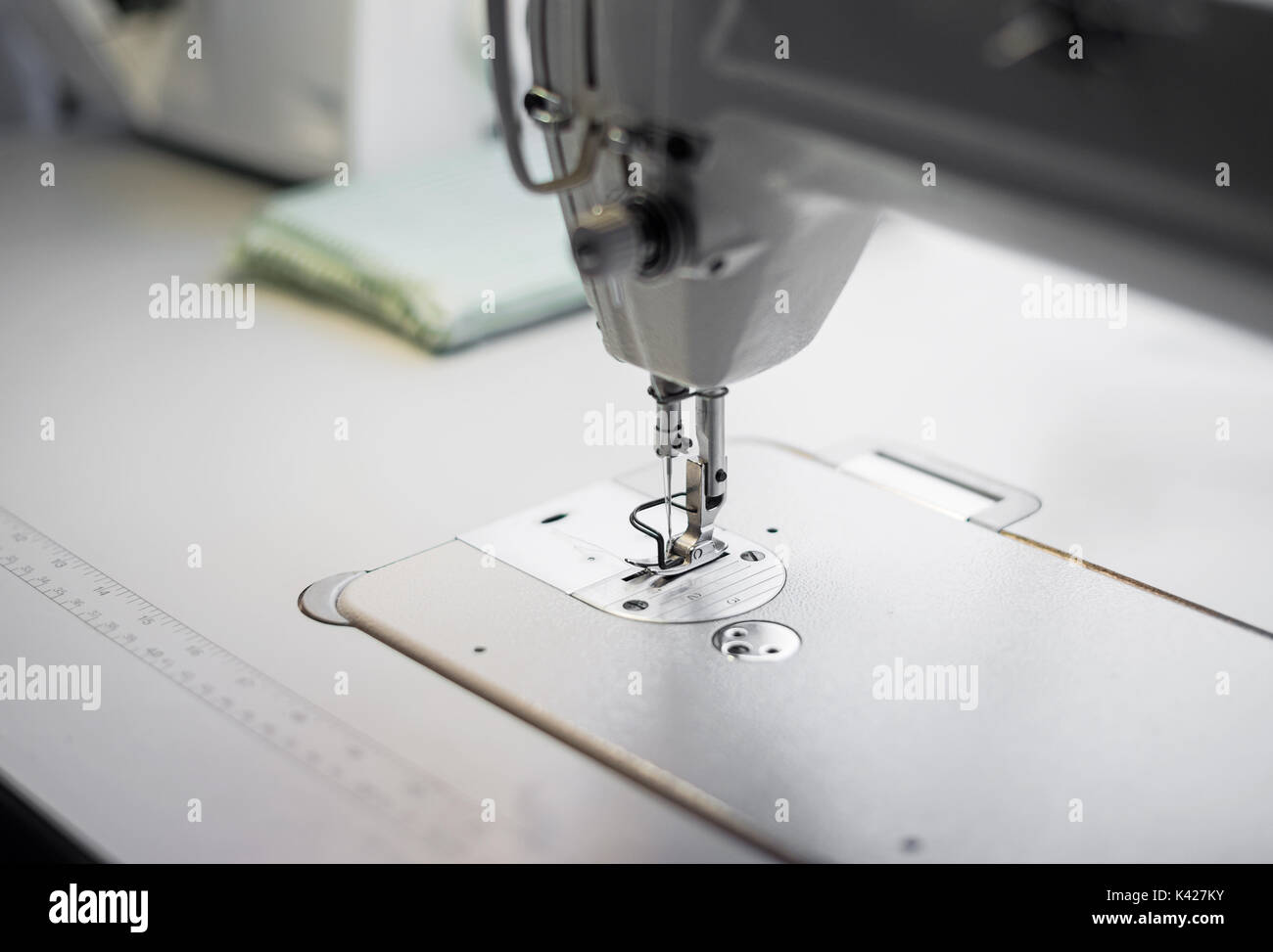 Modern sewing machine at workplace Stock Photo - Alamy