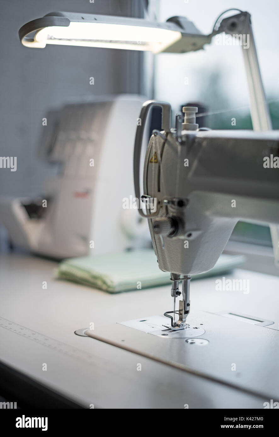 Modern sewing machine at workplace Stock Photo - Alamy