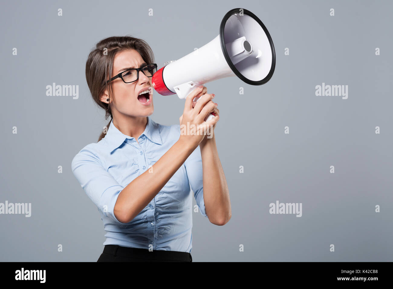 Angry businesswoman screaming very loud Stock Photo - Alamy