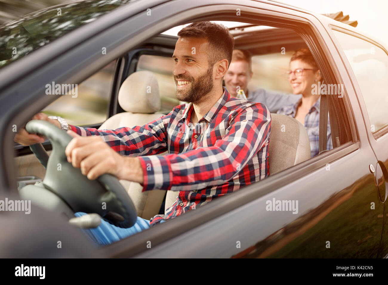 Group of young people enjoying a road trip in the car Stock Photo - Alamy