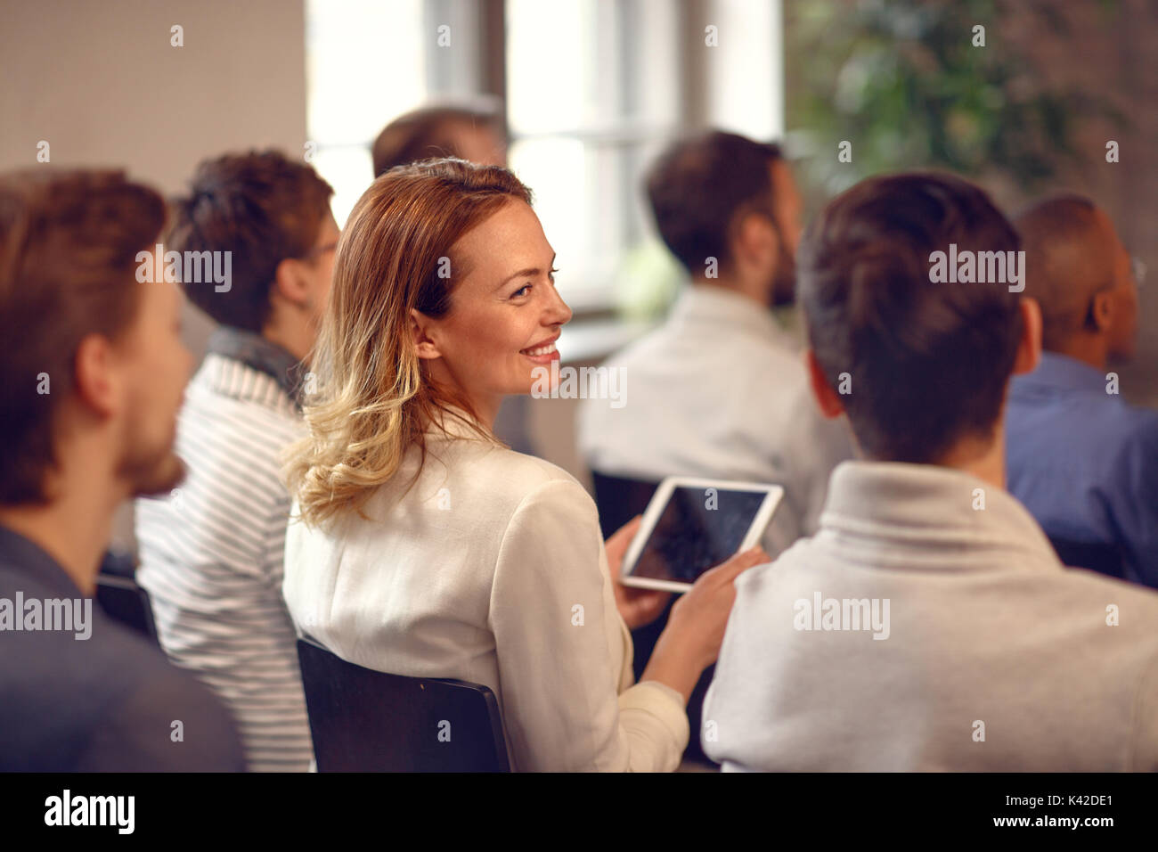 Woman in the audience speaker hi-res stock photography and images - Alamy