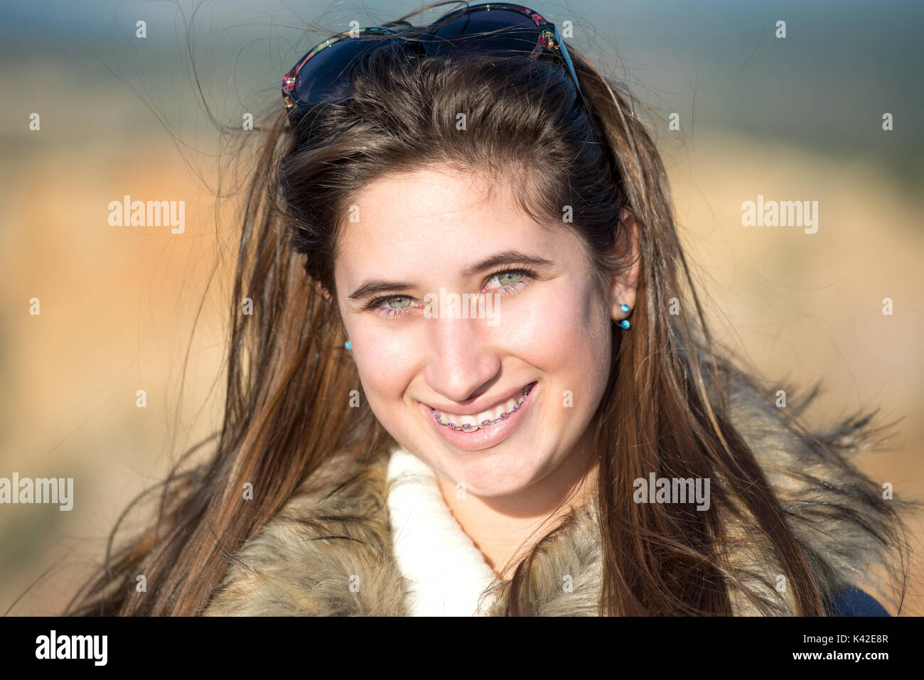 Beautiful and happy young girl posing outdoors Stock Photo - Alamy