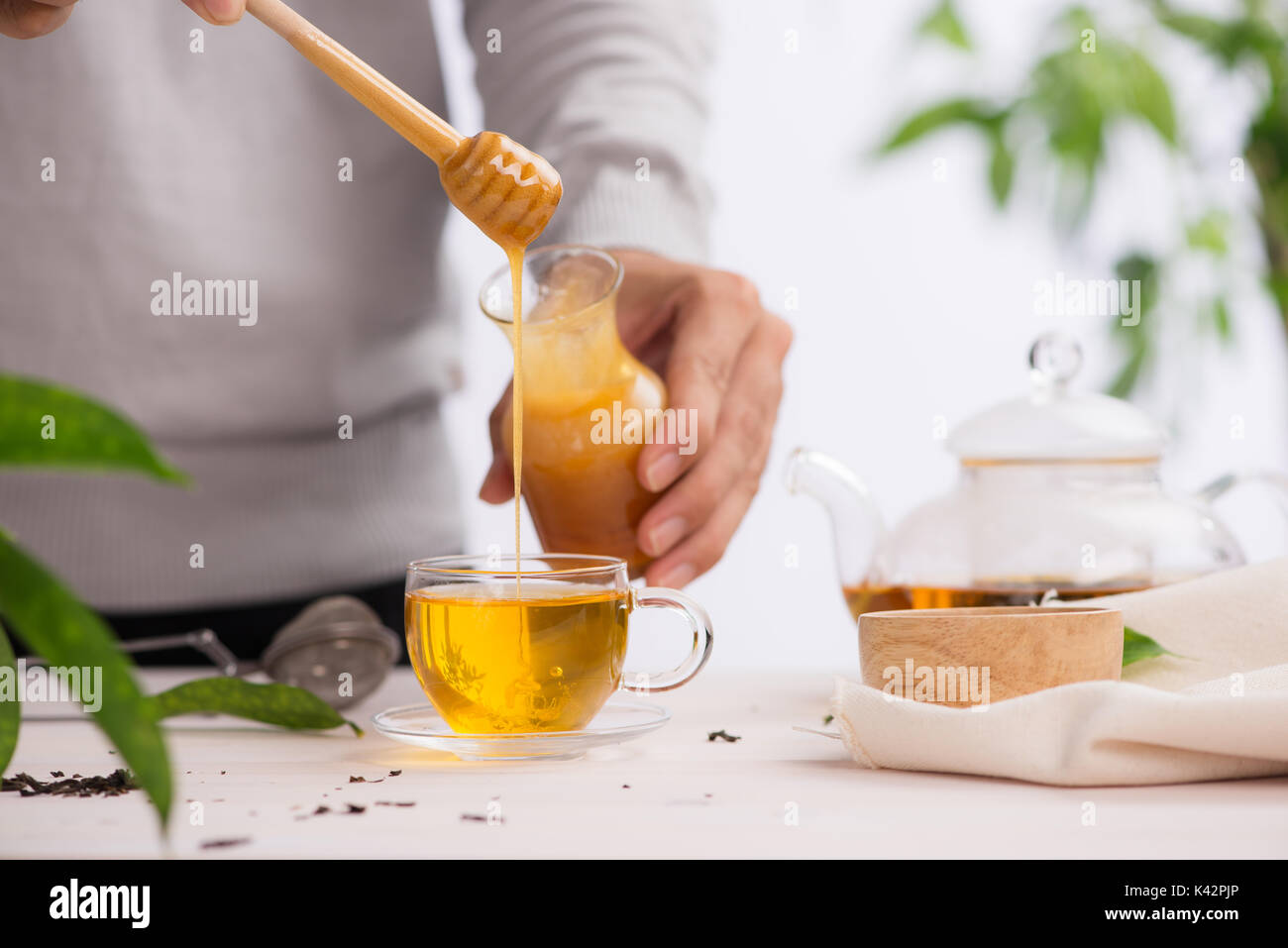 Woman hand pouring herbal tea hi-res stock photography and images - Alamy
