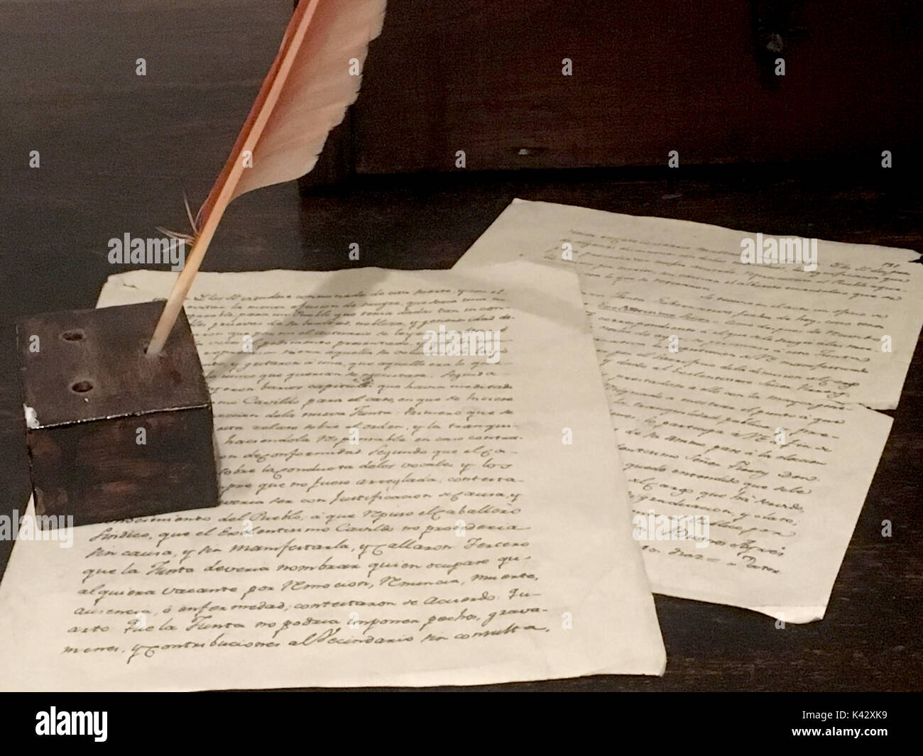 Vintage desk with a letter and ink Feather Stock Photo - Alamy