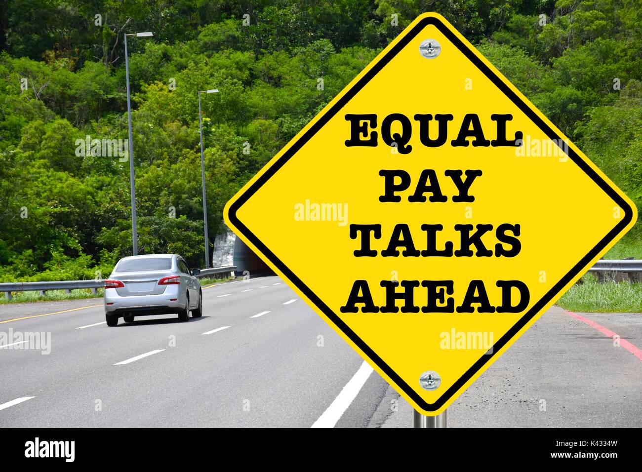 Income inequality Ahead, yellow warning road sign Stock Photo - Alamy