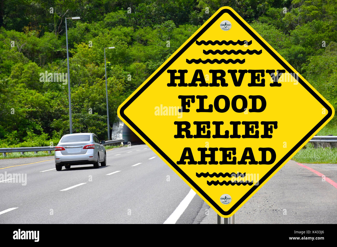 Harvey flood relief ahead, yellow warning road sign Stock Photo - Alamy