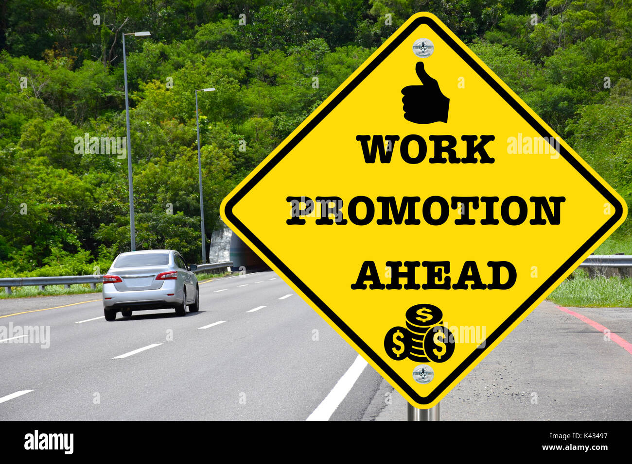 Work promotion ahead, yellow warning road sign Stock Photo - Alamy