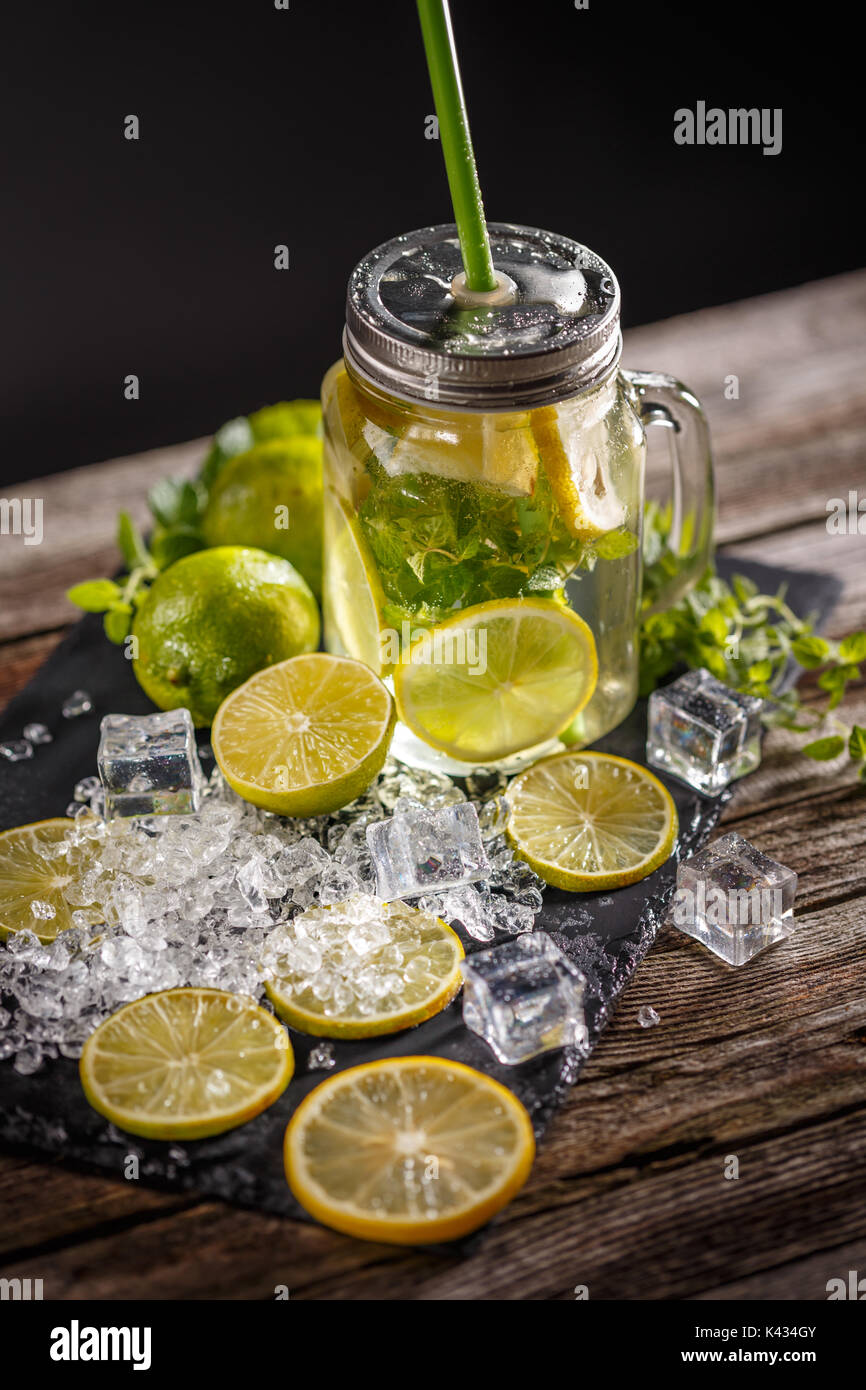 Lemonade with ice in fancy glass with straw Stock Photo - Alamy