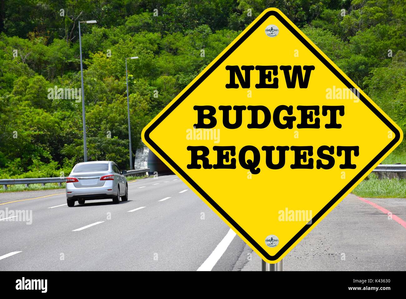 New budget request, yellow warning road sign Stock Photo - Alamy