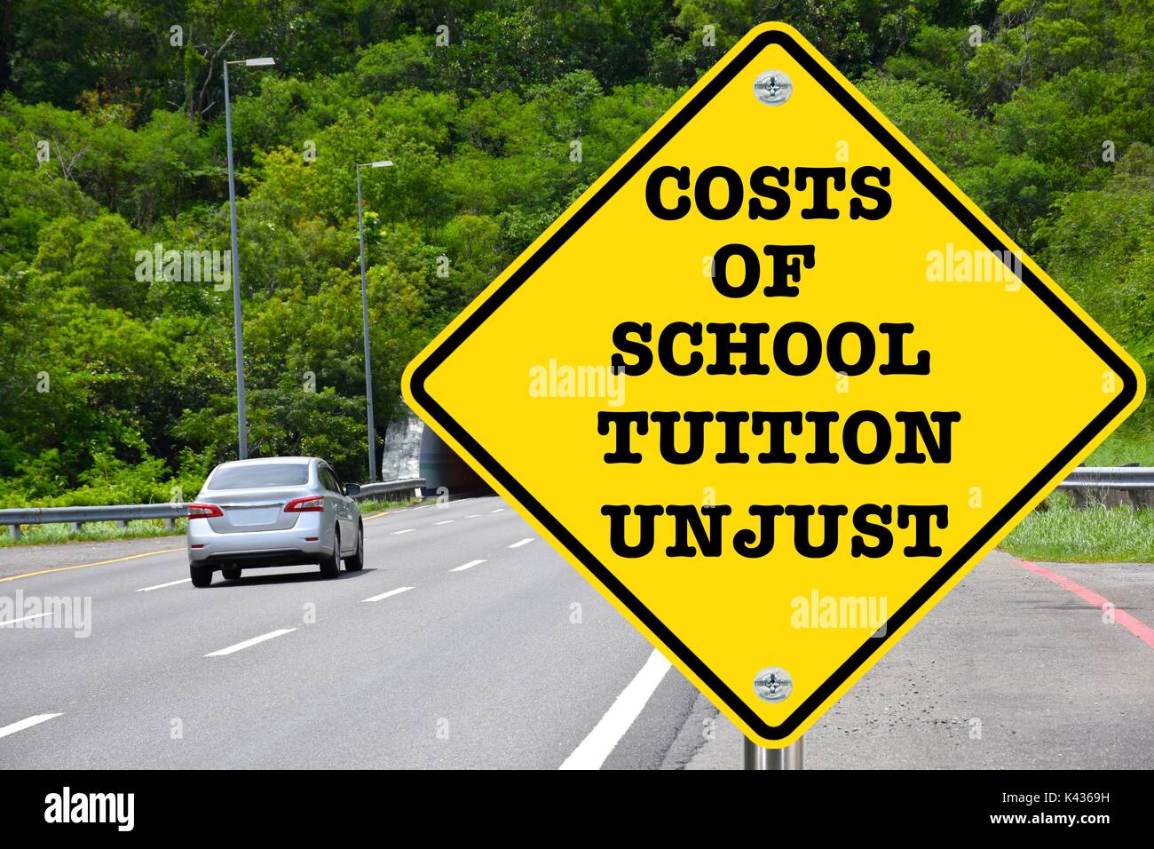 Costs of school tuition unjust, yellow warning road sign Stock Photo ...