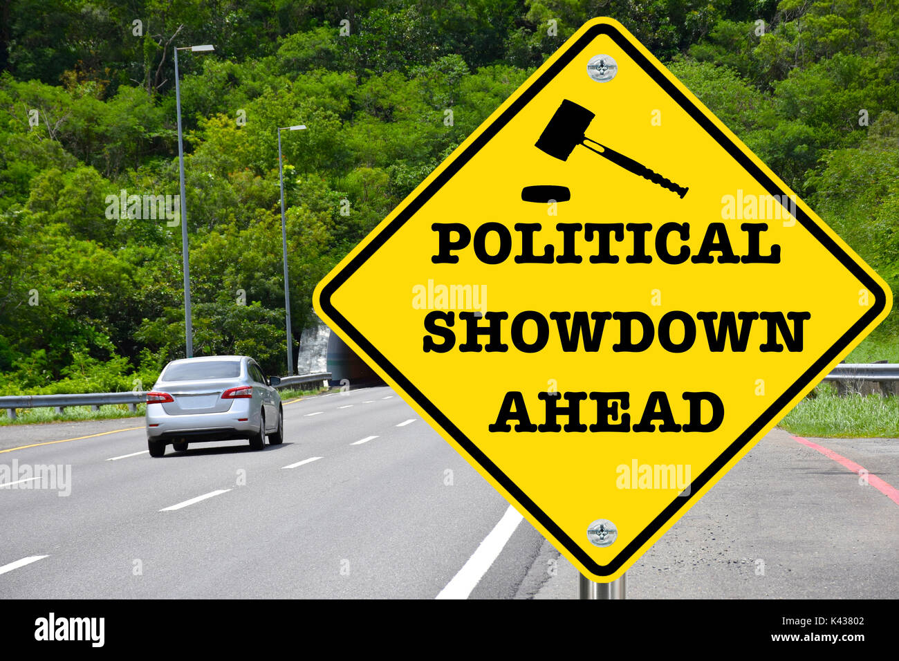 Political showdown ahead, yellow warning road sign Stock Photo - Alamy