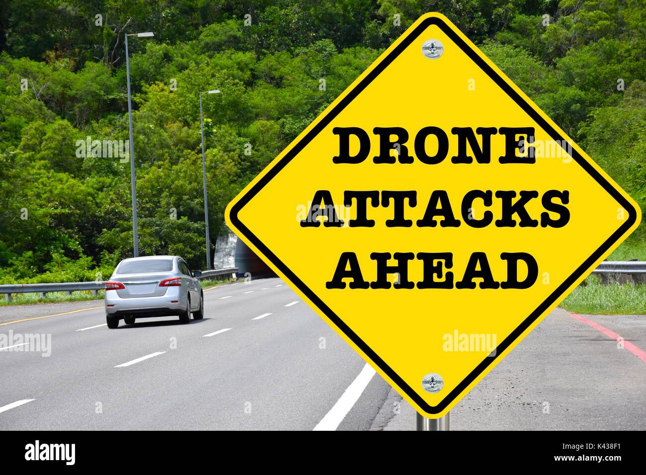 Drone attacks ahead, yellow warning street sign Stock Photo - Alamy