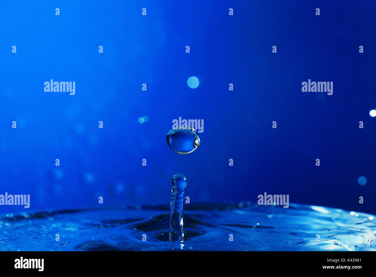 Falling into water droplets Stock Photo - Alamy