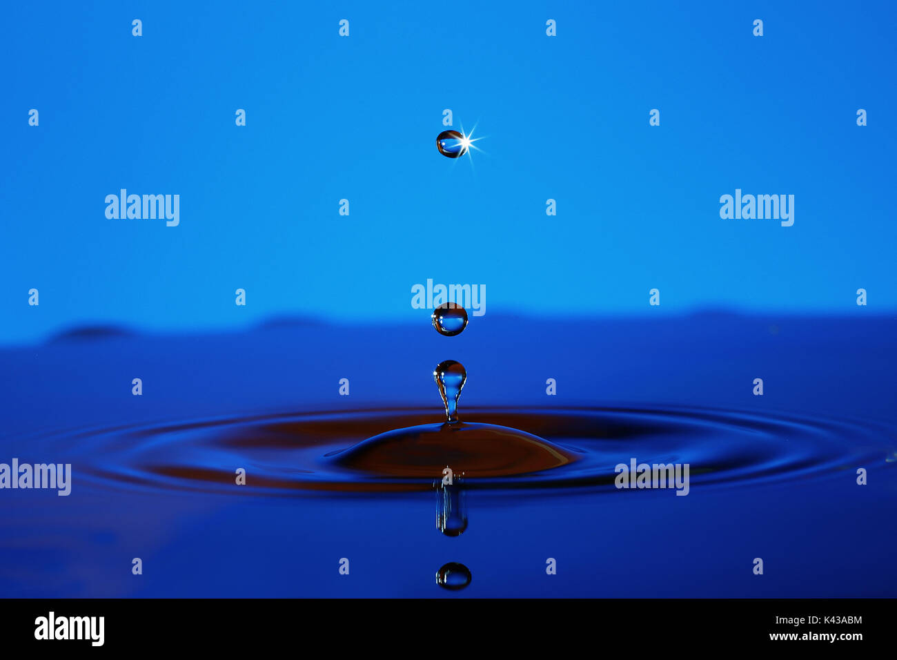 Falling into water droplets Stock Photo - Alamy