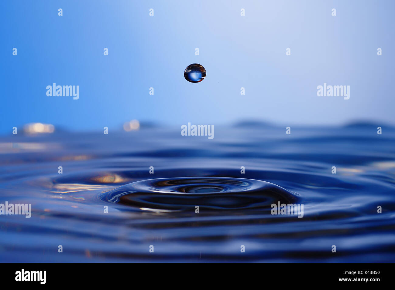 Falling into water droplets Stock Photo - Alamy
