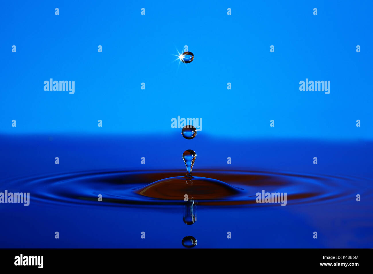 Falling into water droplets Stock Photo - Alamy
