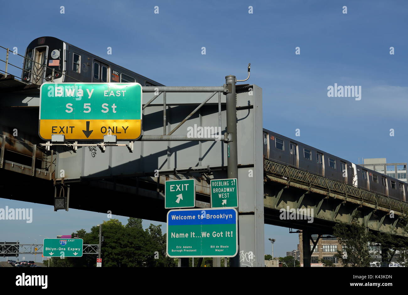 Signs coming off of the Williamsburg Bridge in Williamsburg, Brooklyn ...