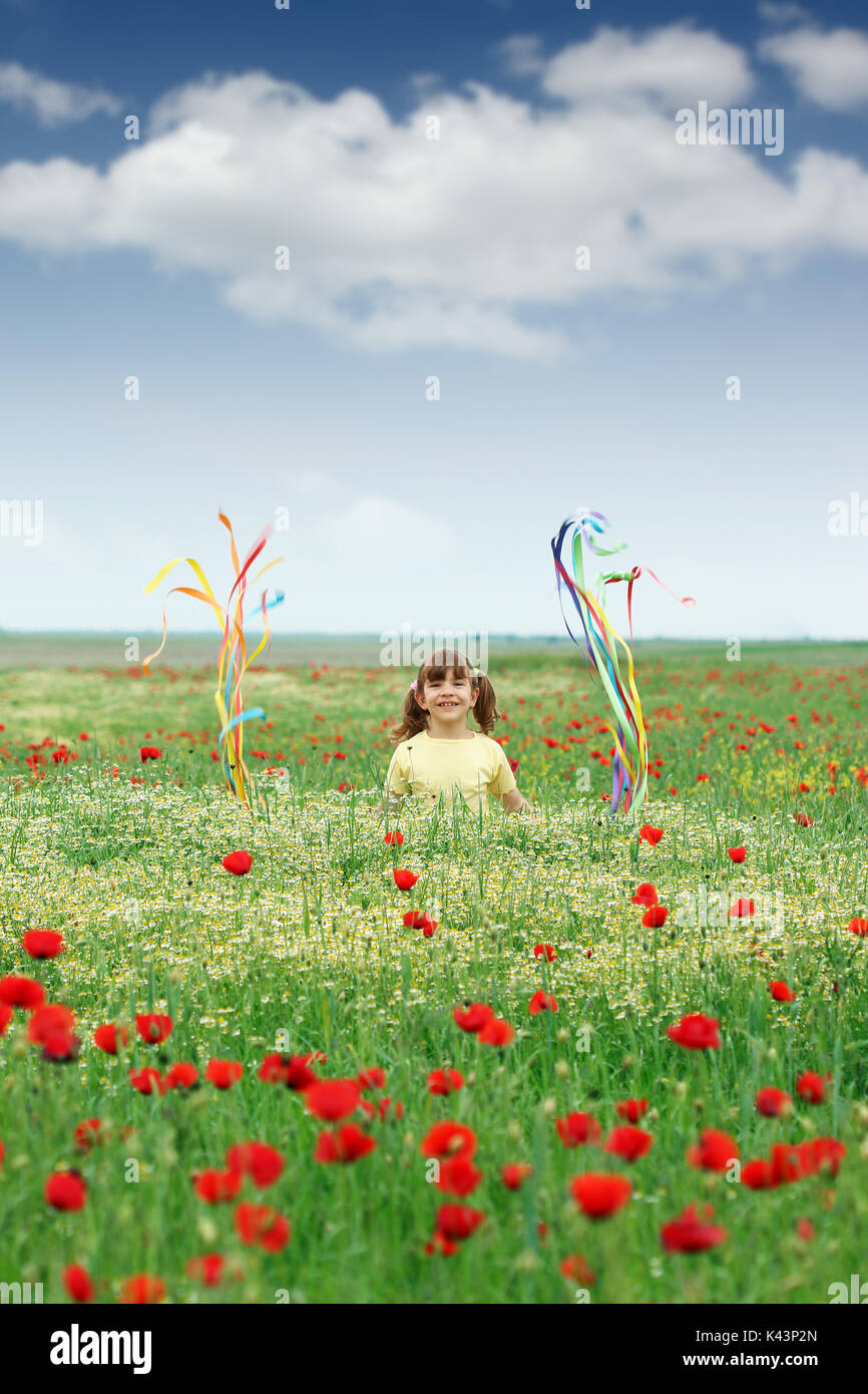 happy little girl on meadow spring season Stock Photo - Alamy