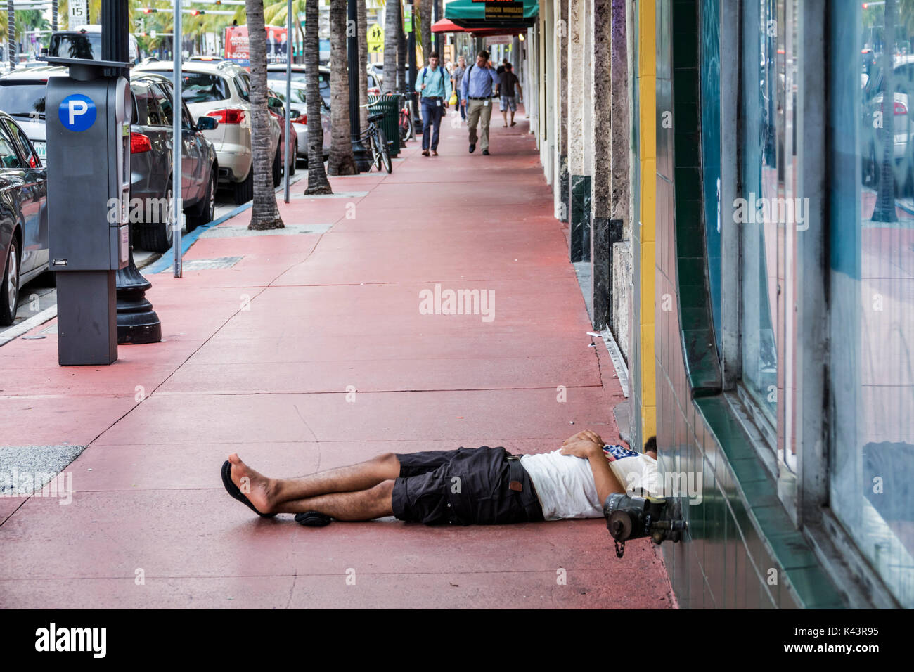 Miami Beach Florida,homeless,adult adults man men male,sidewalk ...