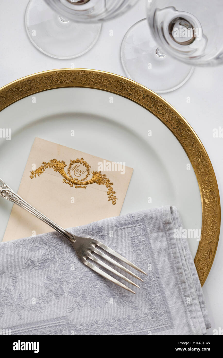 Menu in a golden plate on a table Stock Photo - Alamy