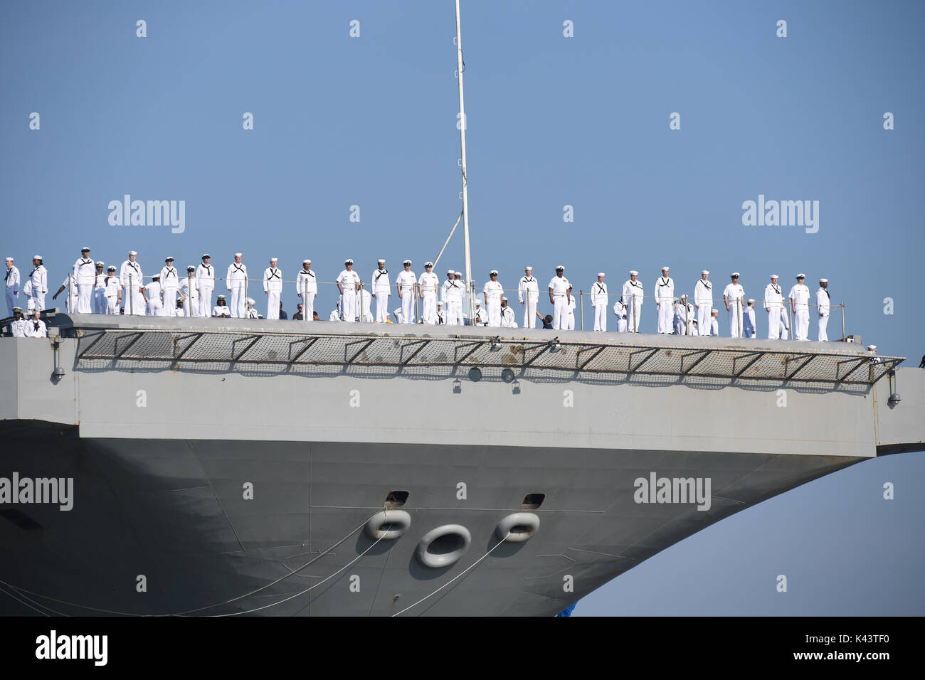 U.S. sailors man the rails of the U.S. Navy Nimitz-class aircraft ...