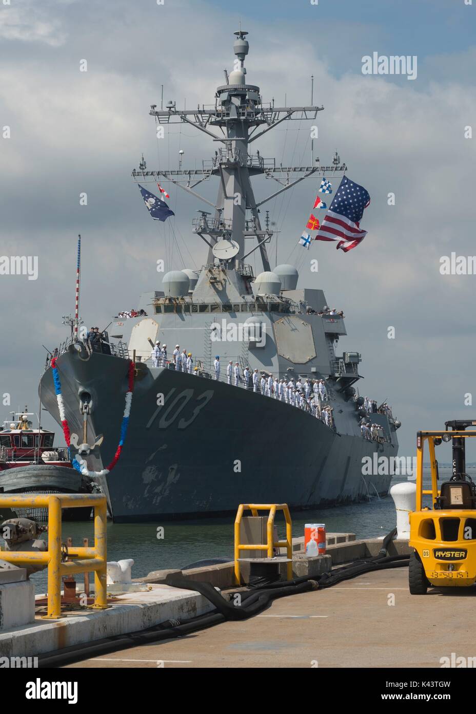 U.S. sailors man the rails of the U.S. Navy Arleigh Burke-class guided ...