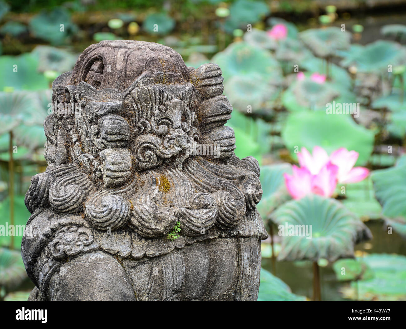 Part of God statue at the ancient temple in Bali, Indonesia. Bali is ...