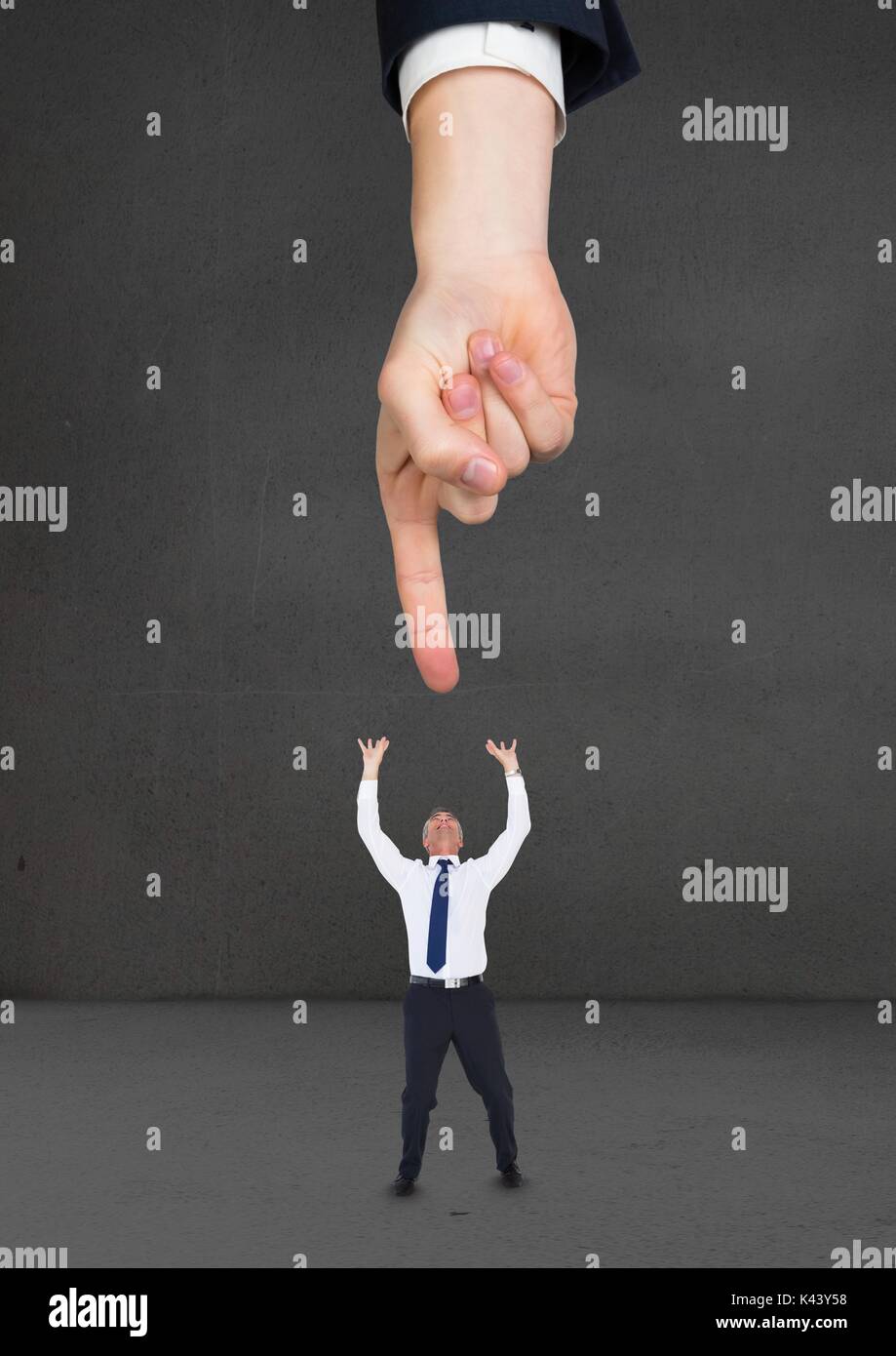 Digital composite of Big business man hand pointing to a small scared ...
