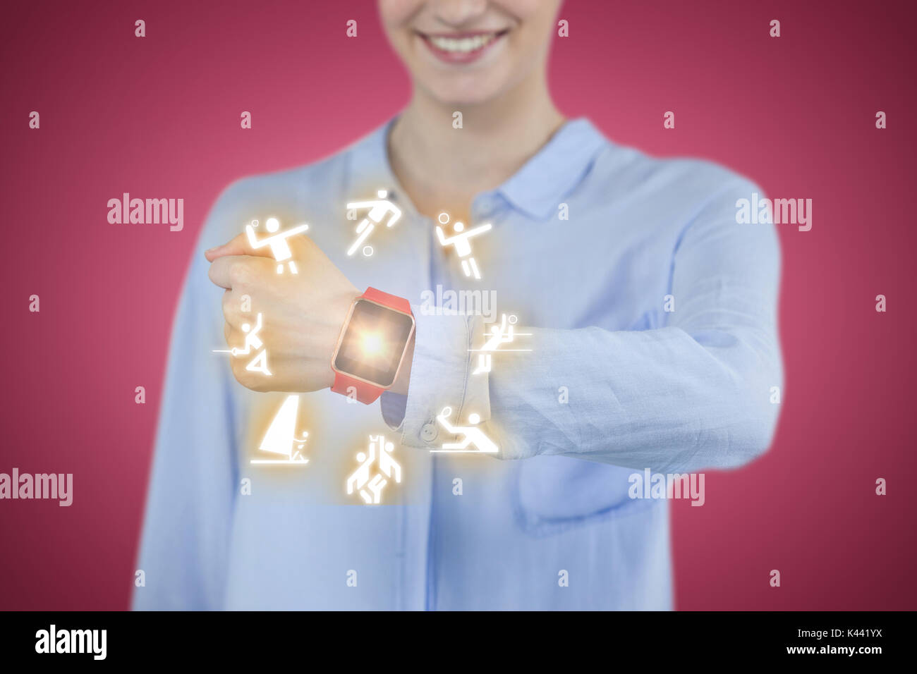 Businesswoman wearing smartwatch against red and white background Stock ...