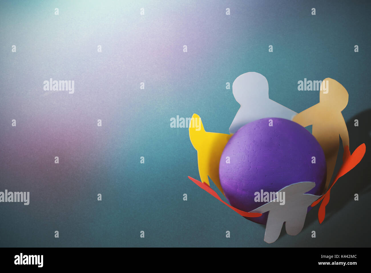 Multiple color of little person against blue background Stock Photo - Alamy