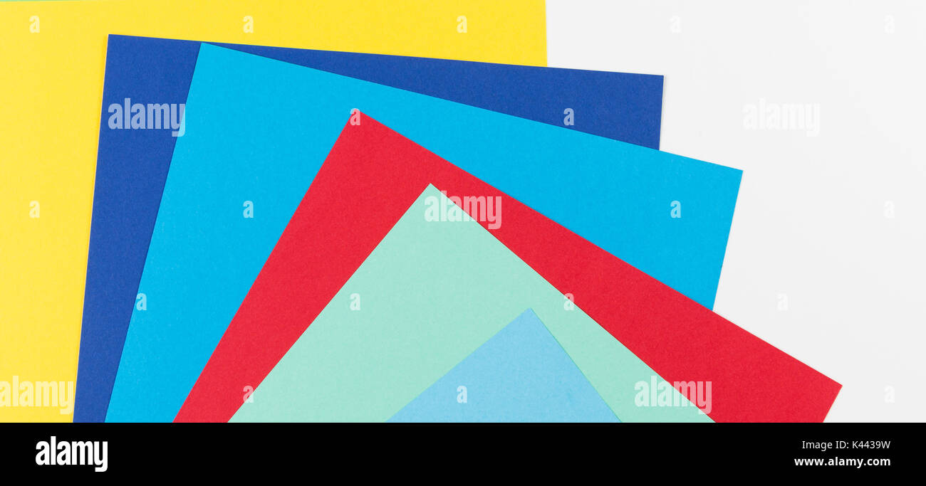Colored paper on white background Stock Photo - Alamy