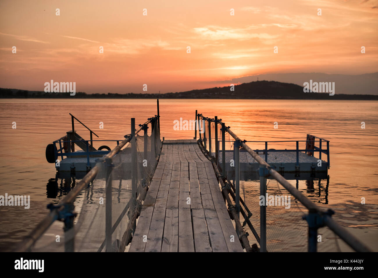 Wooden bridge on the beach and beautiful sunset near the sea Stock ...