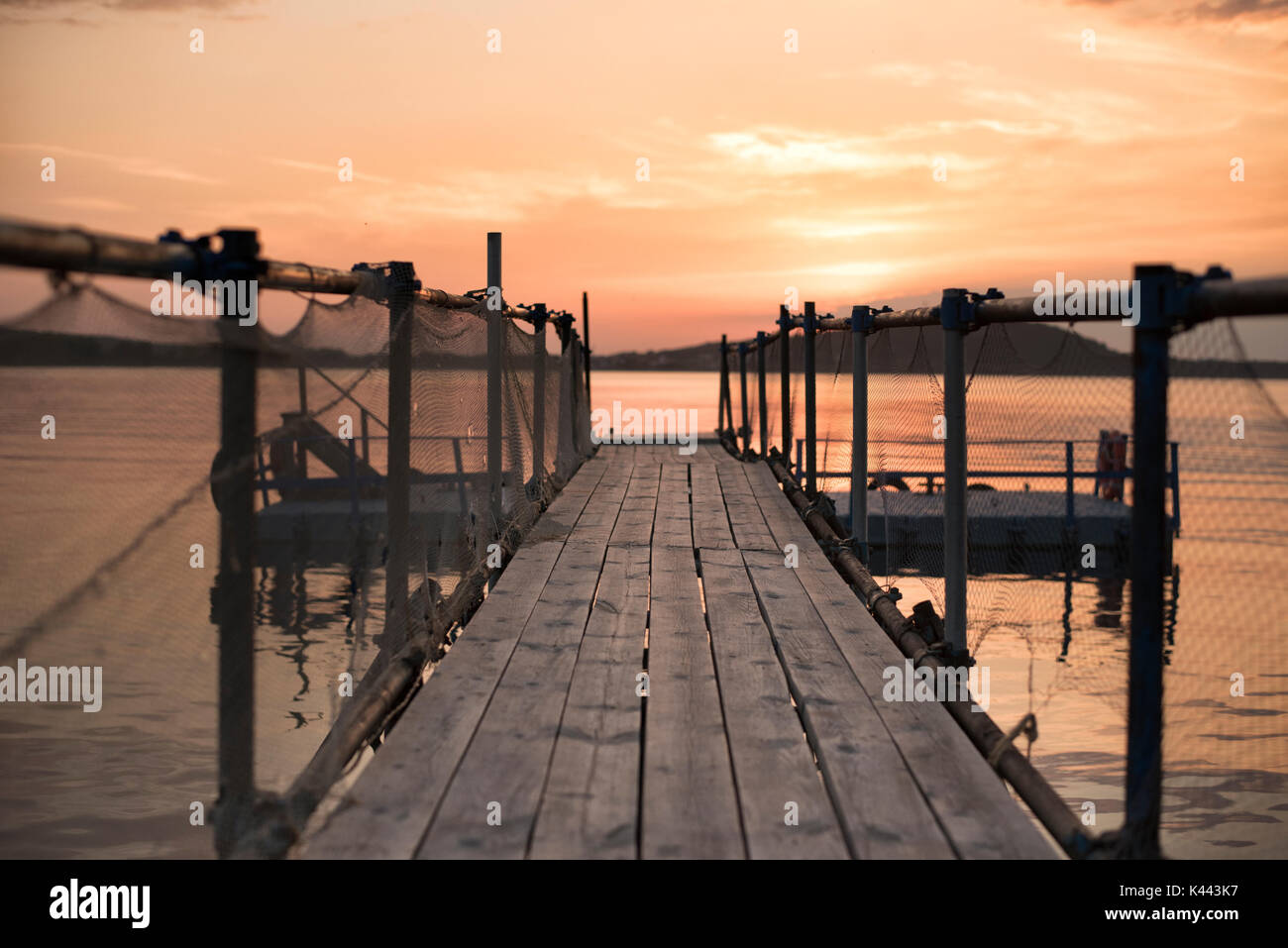 Wooden bridge on the beach and beautiful sunset near the sea Stock ...