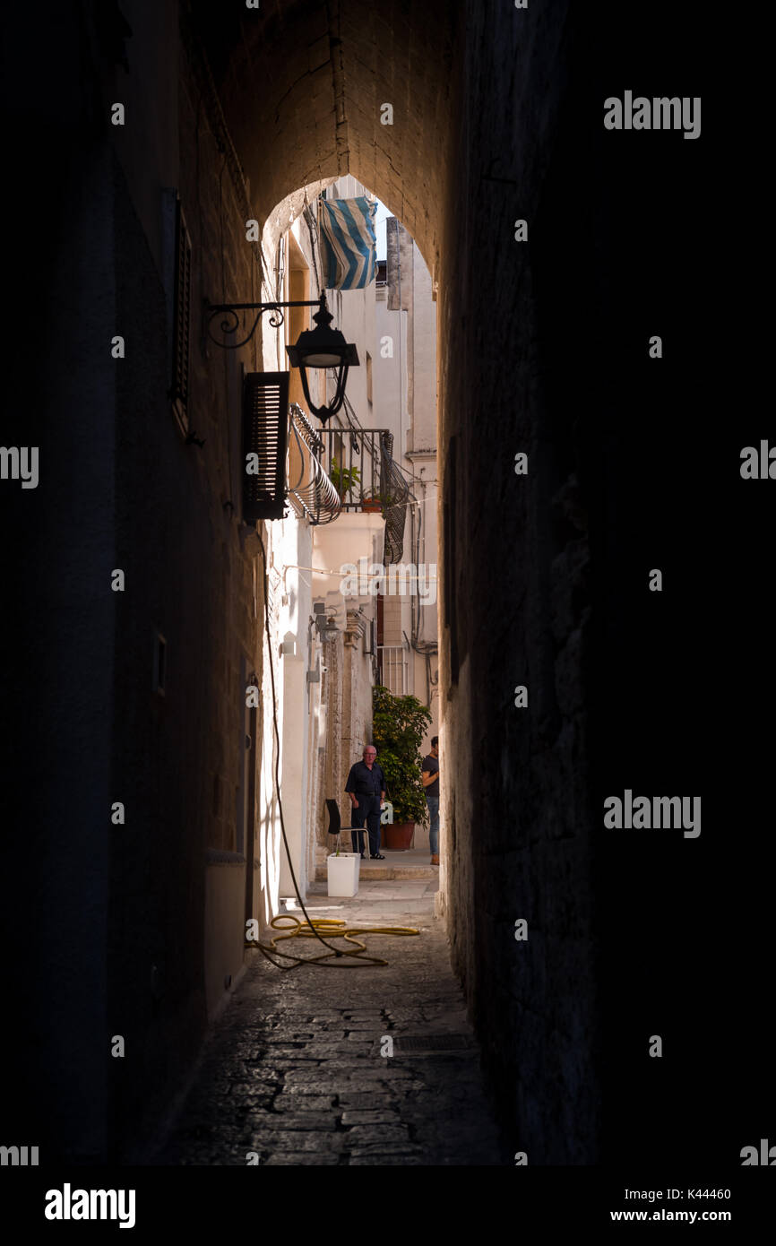 A typical narrow lane in the town of Monopoli,Puglia, Italy Stock Photo ...