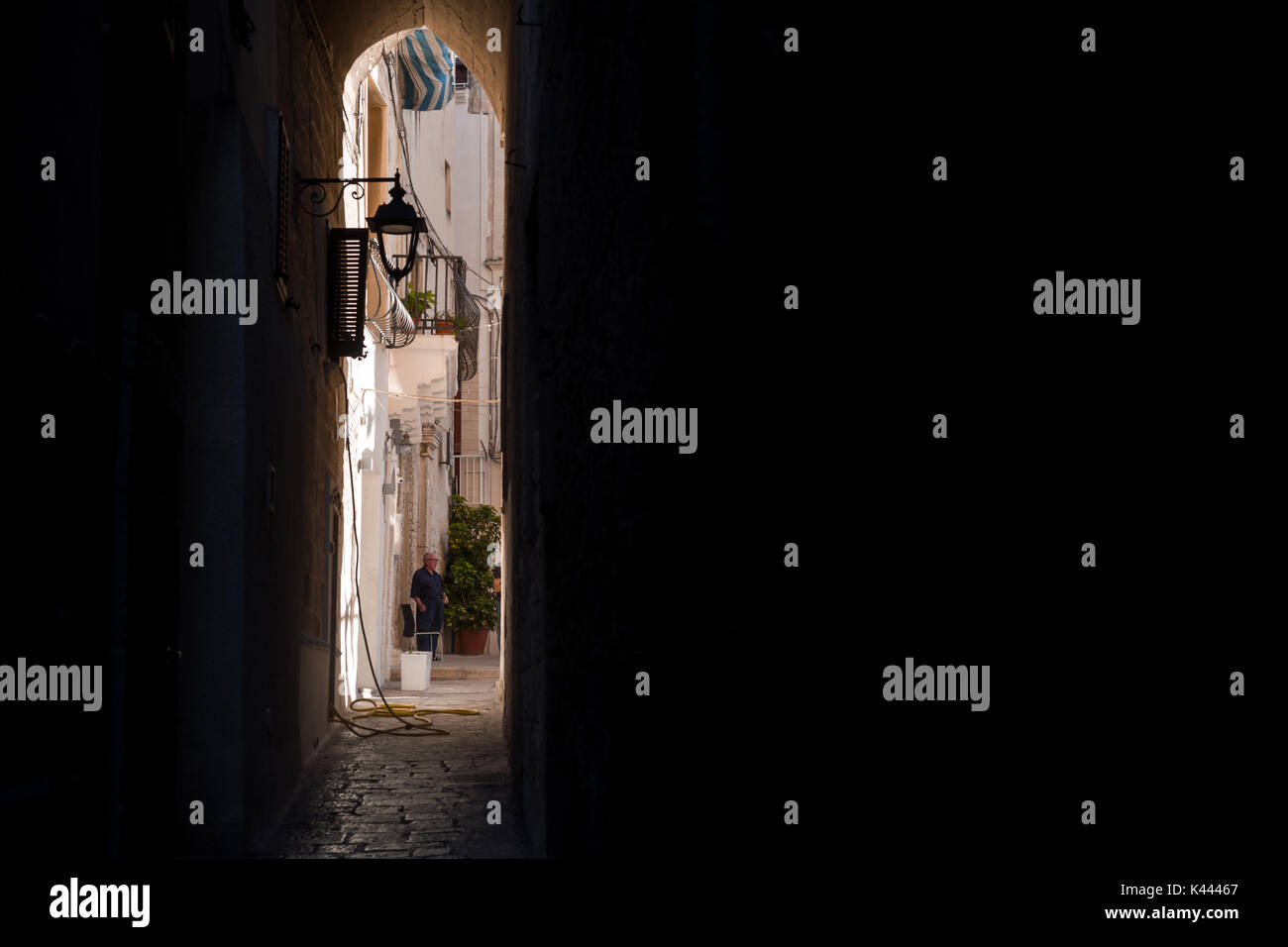 A typical narrow lane in the town of Monopoli,Puglia, Italy Stock Photo ...