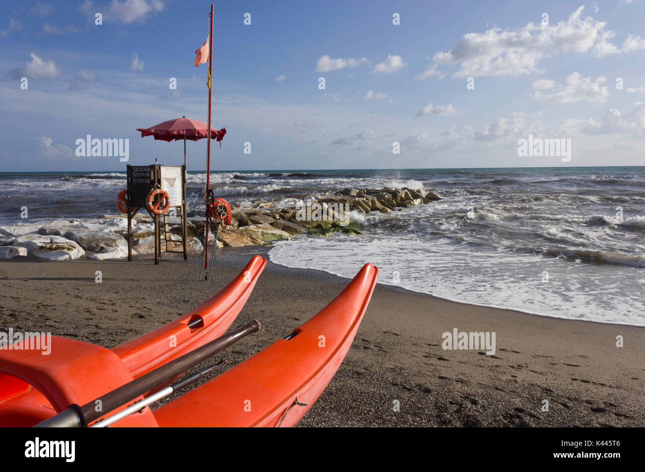 MARINA DI MASSA, ITALY - AUGUST 17 2015: Lifeguard tower and rowing ...