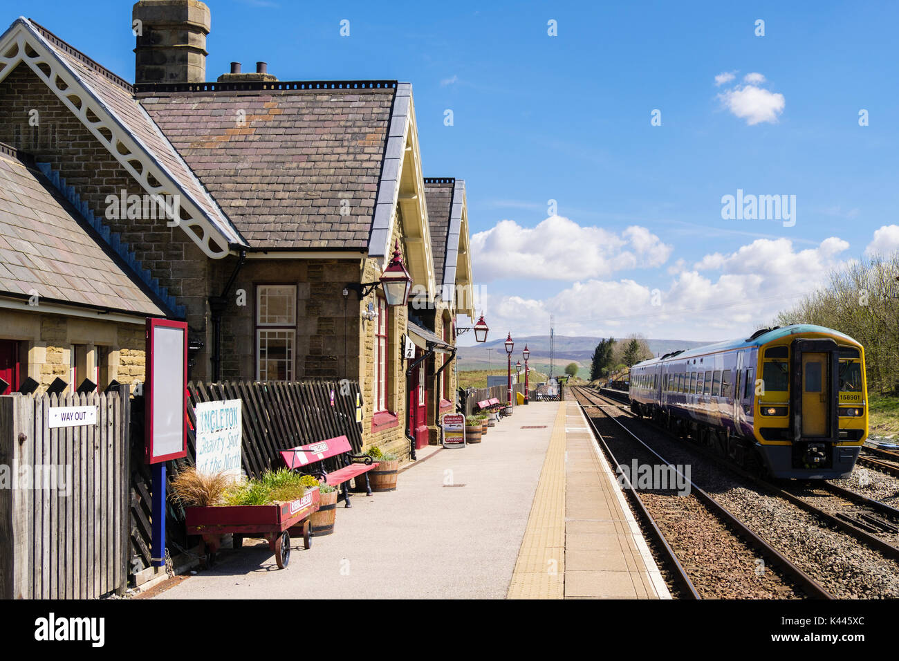 Passenger train leaving Ribblehead station on Settle to Carlise railway ...
