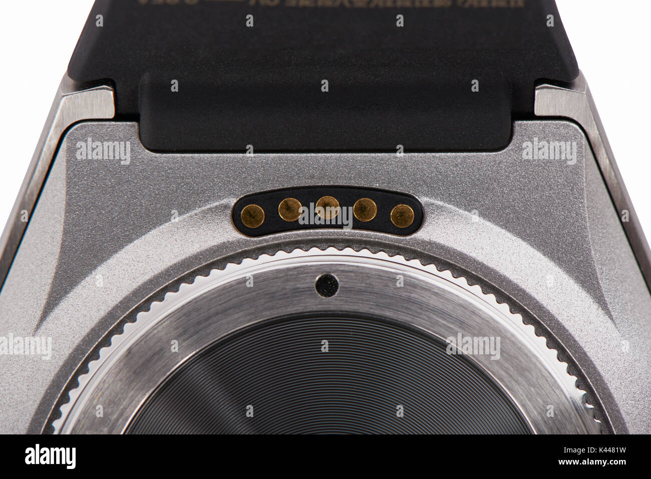 closeup of charge terminal on the back of smart watch. Smart watch has ...