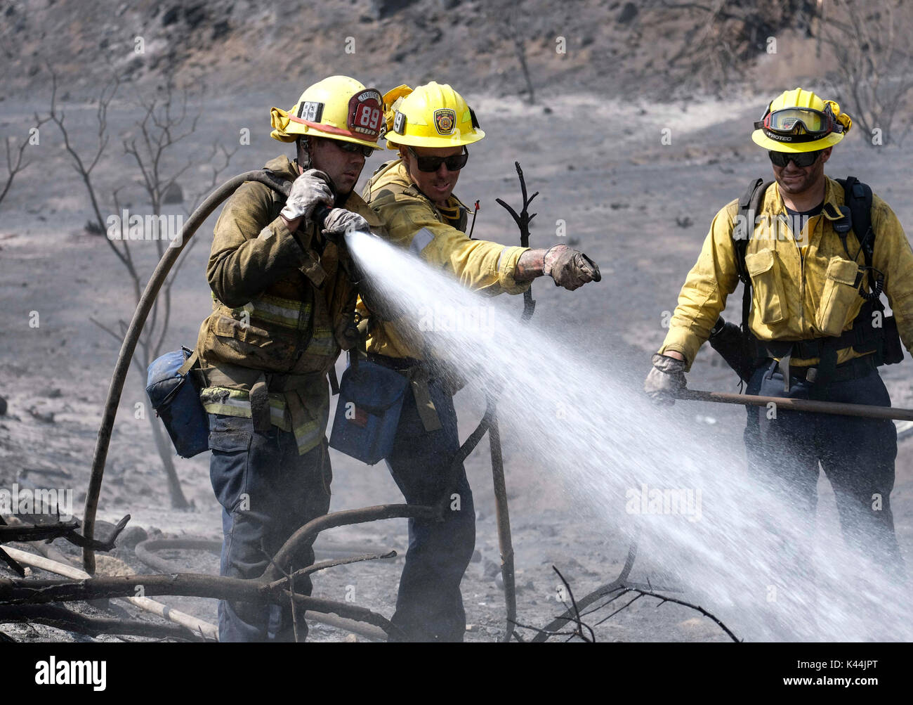 Los Angeles, USA. 4th Sep, 2017. Firefighters douse hot spots from a ...