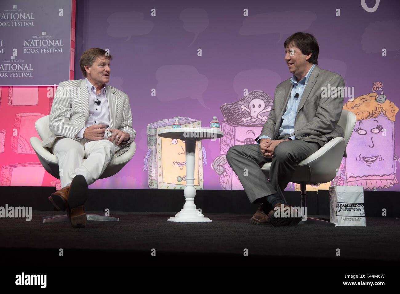 Michael Lewis (left) is interviewed by Joel Achenbach of the Washington ...