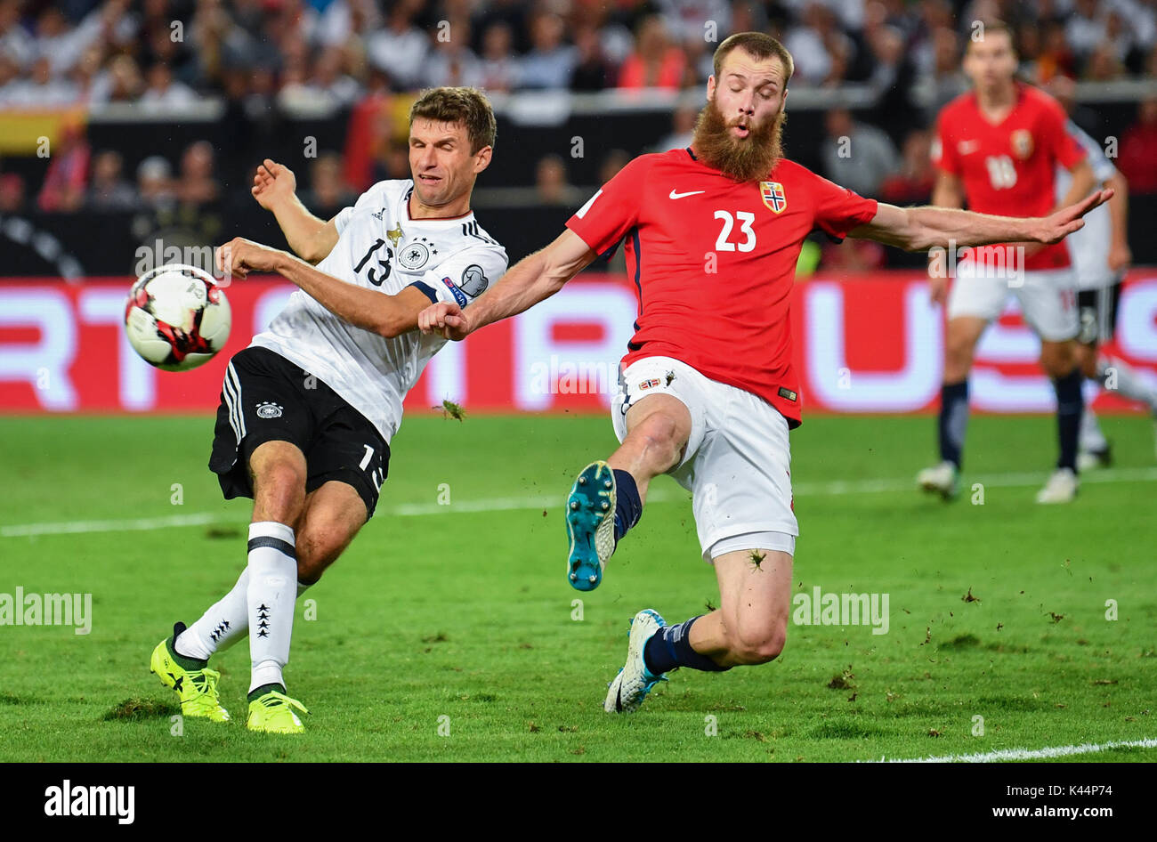 Germany's Thomas Mueller (L) and Norway's Jo Inge Berget vie for the ...