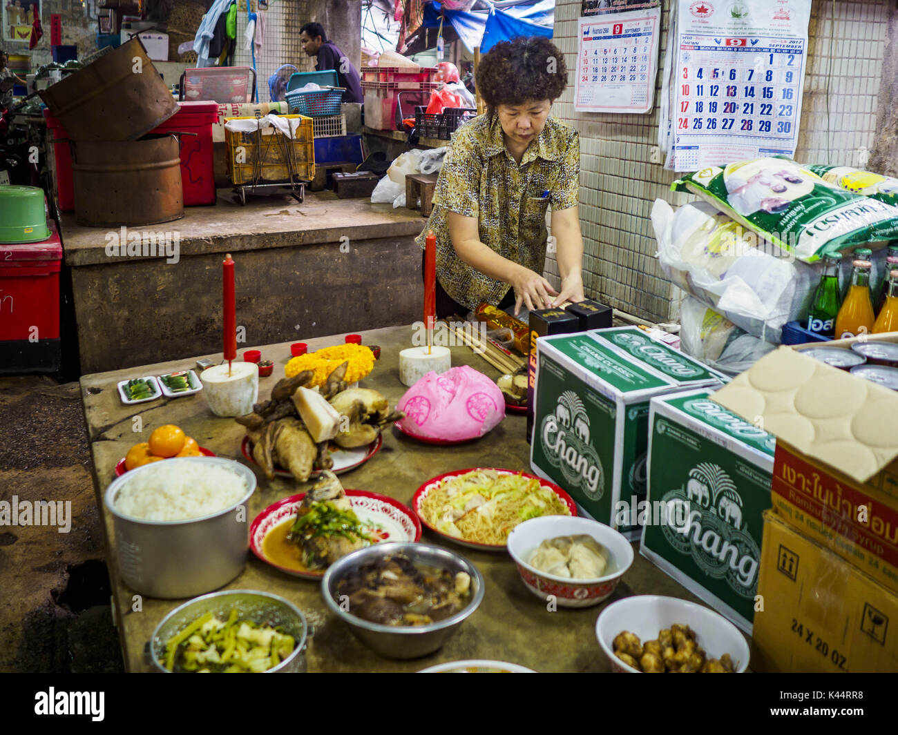 Bangkok, Thailand. 5th Sep, 2017. A woman sets up her Hungry Ghost Day ...