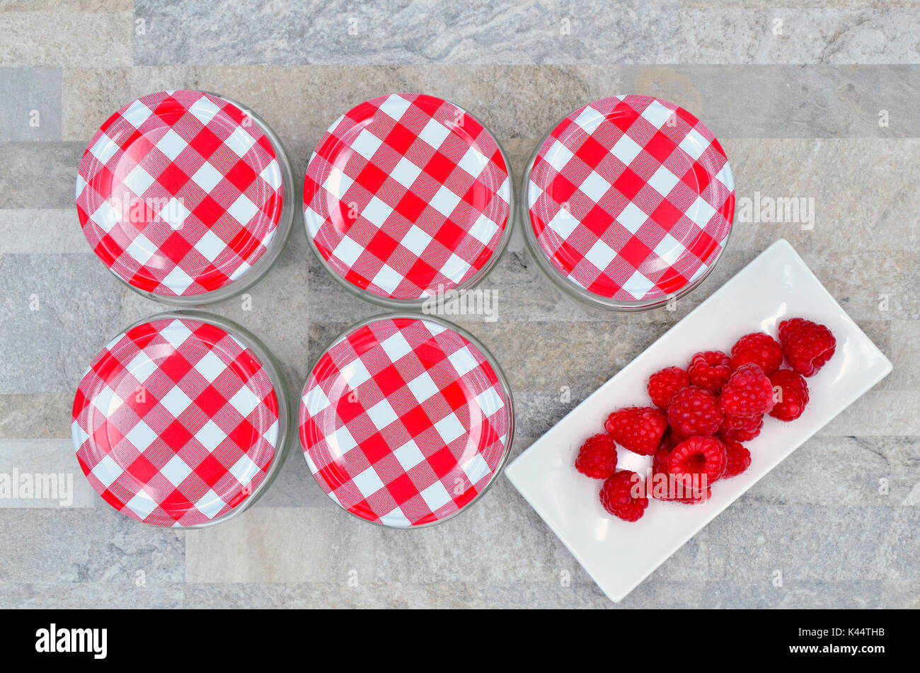 glass jars with raspberry Stock Photo - Alamy