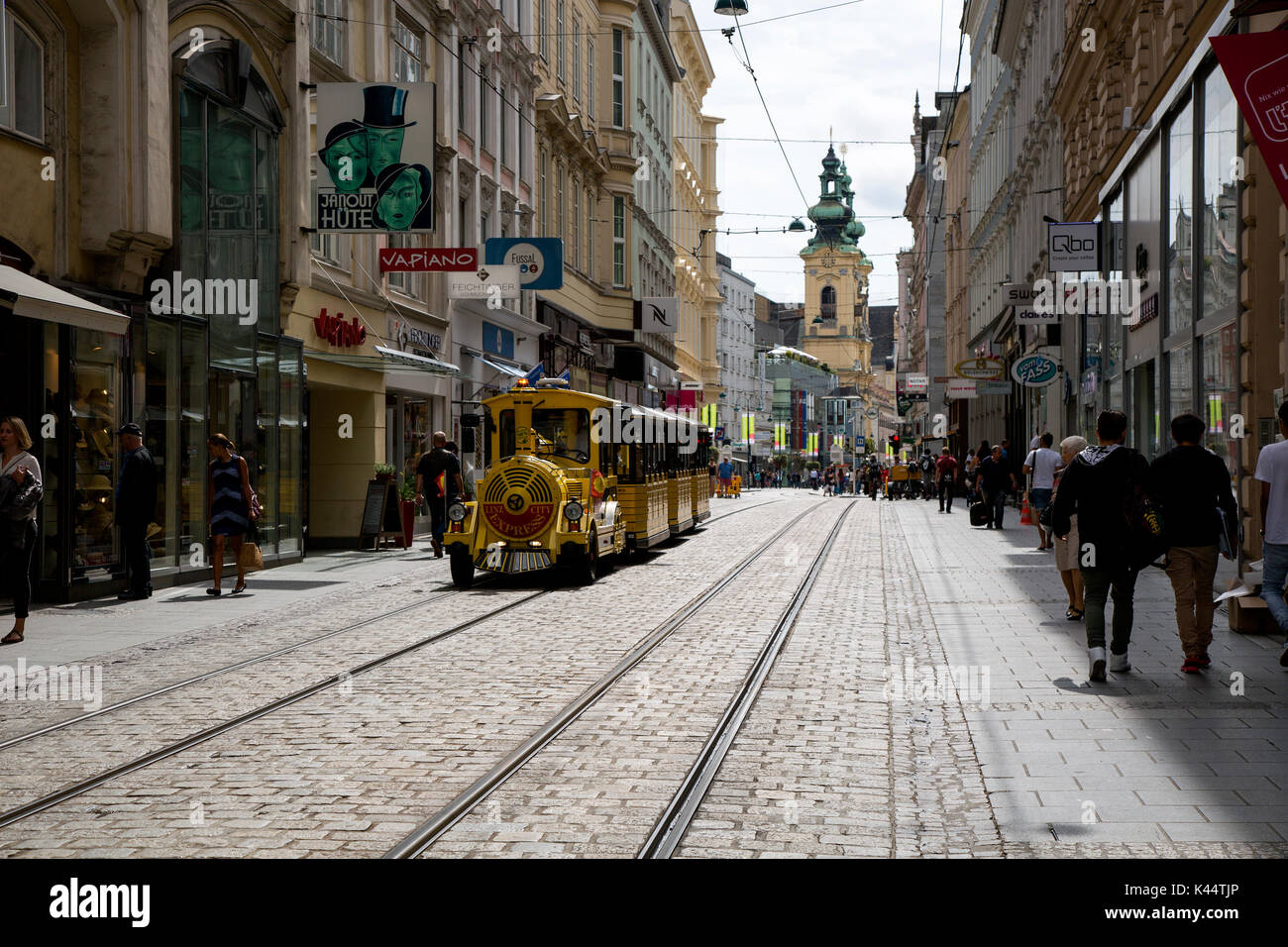 A street scene from the city of Linz, Czechoslovakia featuring a ...