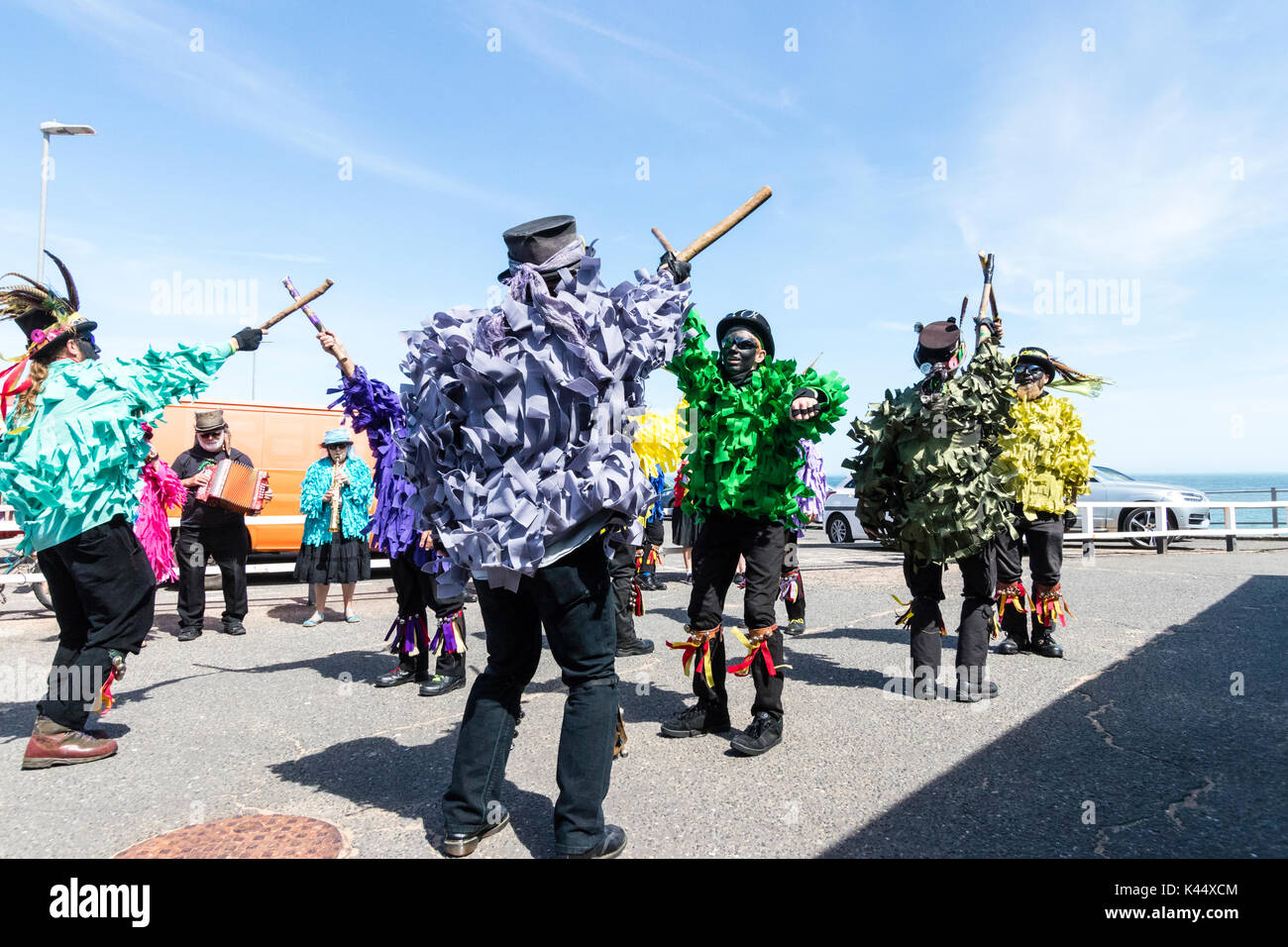 Traditional morris men wearing top hats and tatter jackets in various ...