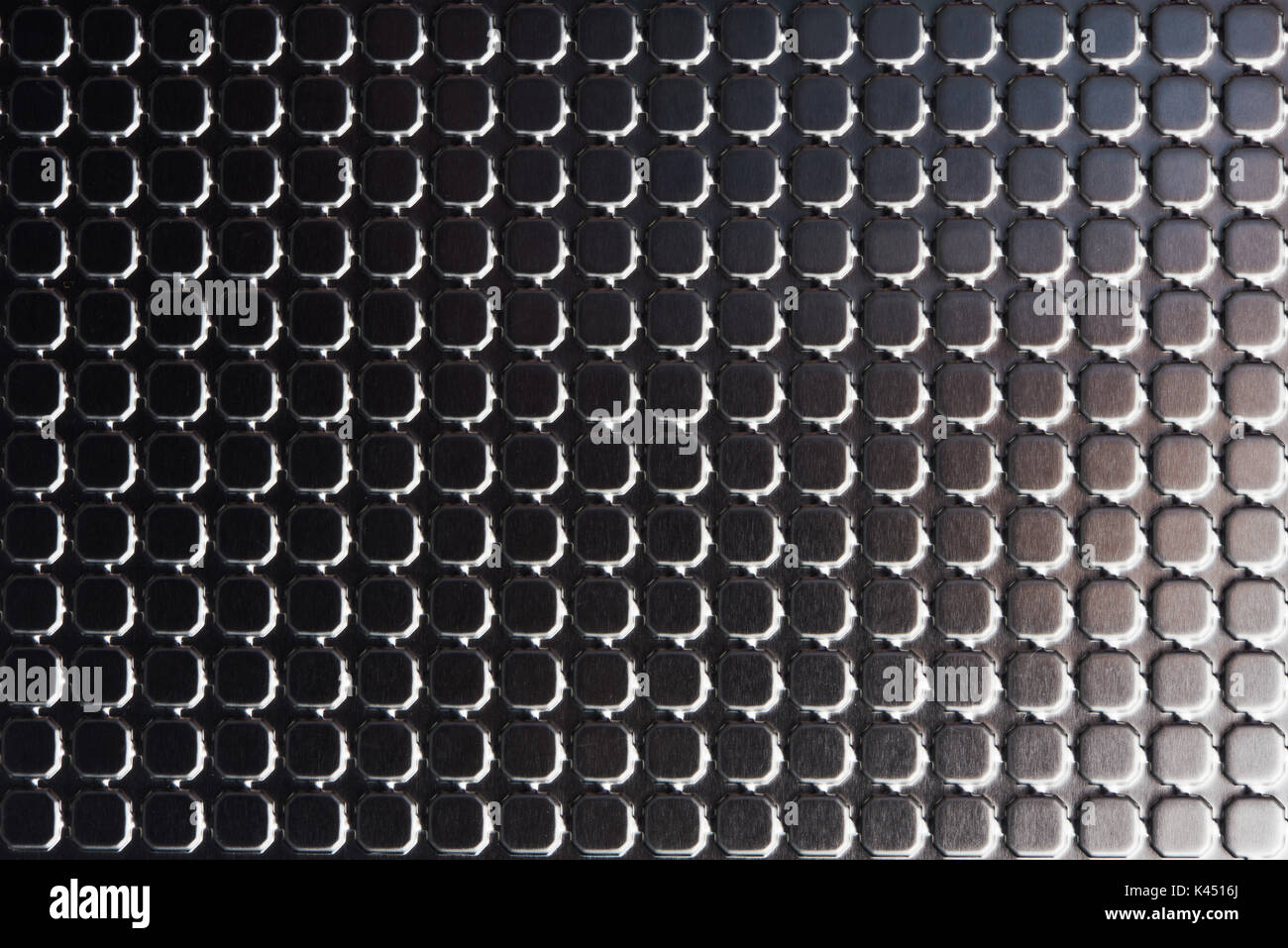Metal square pattern surface close-up. Texture of design on metal Stock ...
