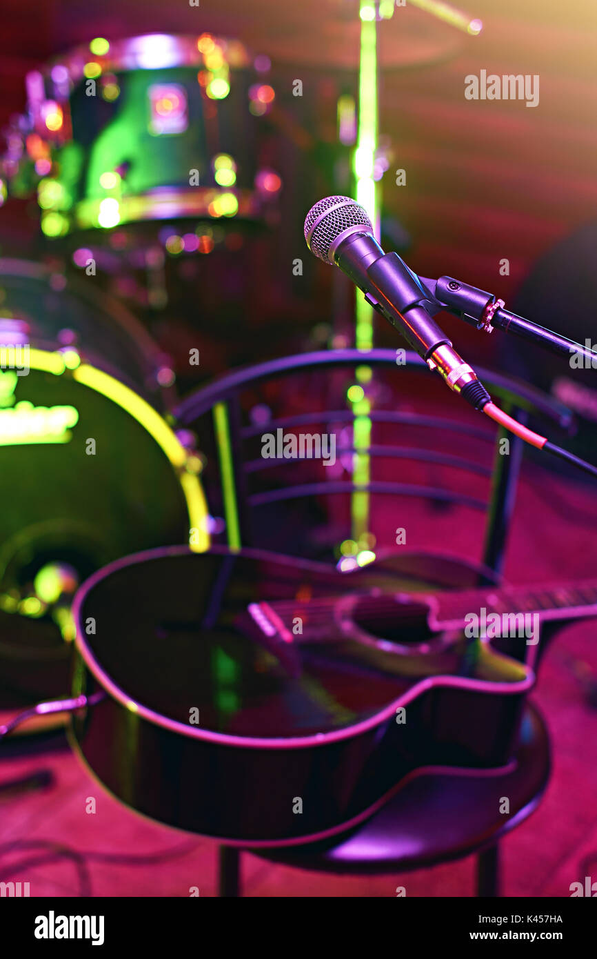 Microphone at concert on the stage with colorful light Stock Photo - Alamy