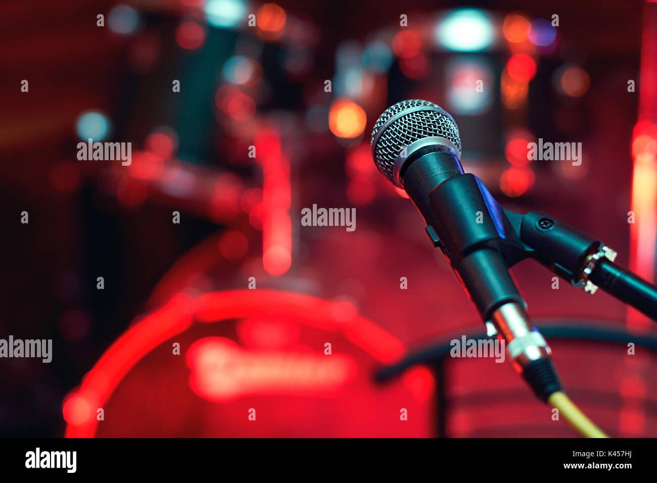 Microphone at concert on the stage with colorful light Stock Photo - Alamy